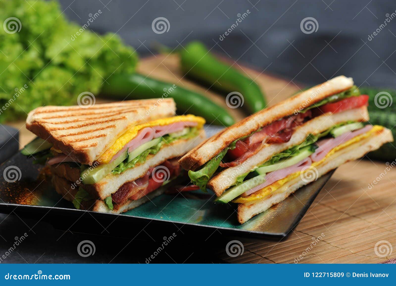 Triangular Shaped Sandwiches with Ham and Omelet on a Plate Stock Image ...