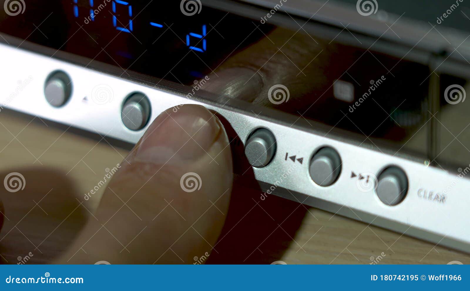 Pressing the Button on the Control Panel of the DVD Player with Your ...