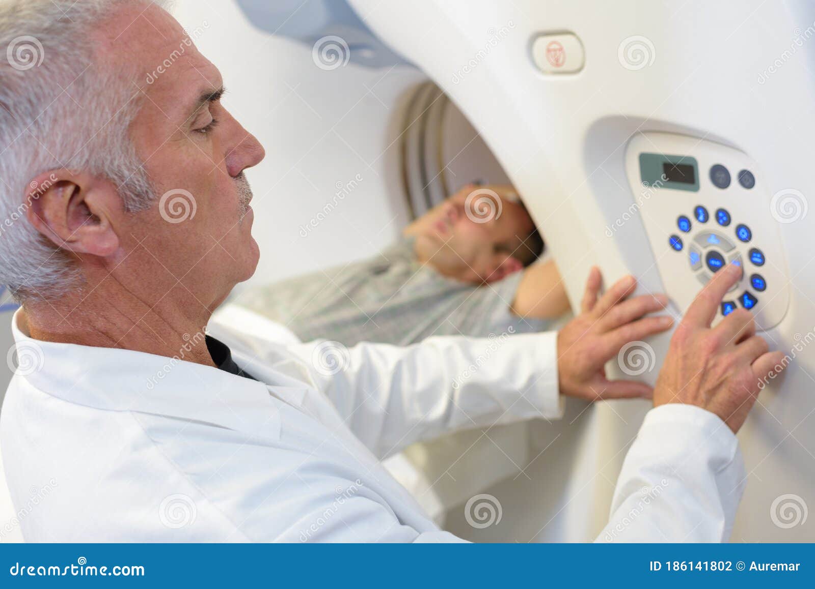 He pressing mri buttons stock photo. Image of expertise - 186141802