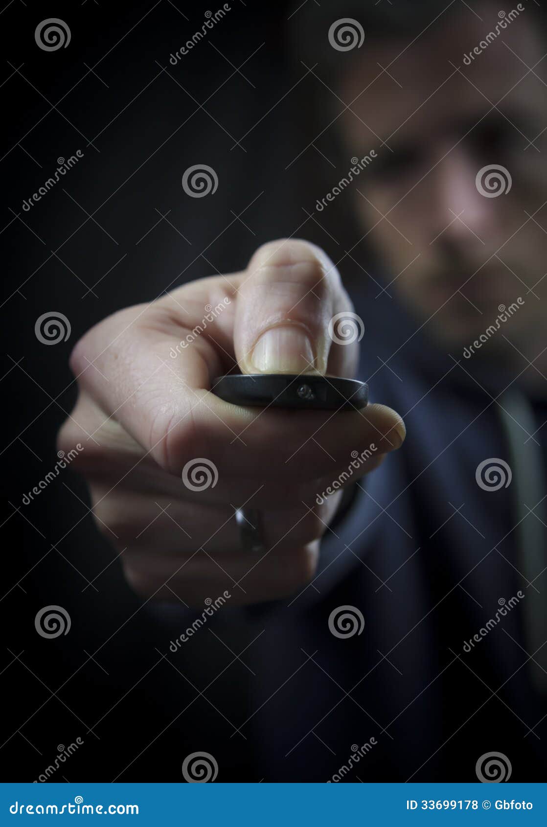 Pressing the remote stock photo. Image of remote, dark - 33699178