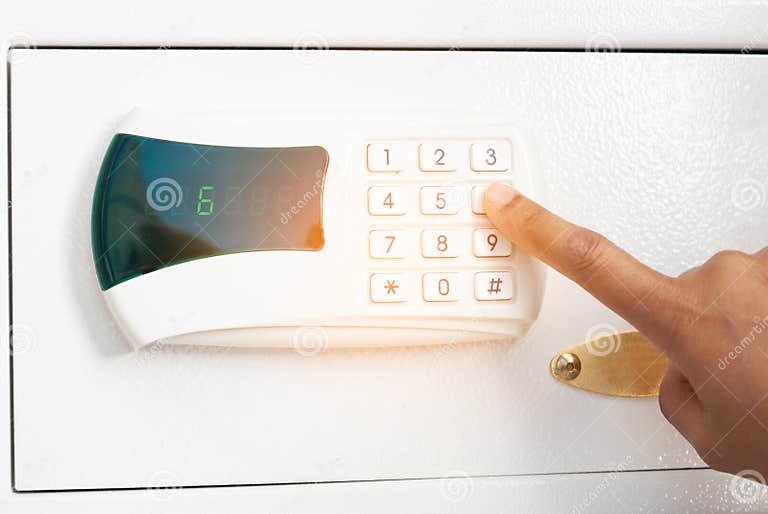 Pressing Security Code on Number Button for Unlocking Safe Stock Image ...