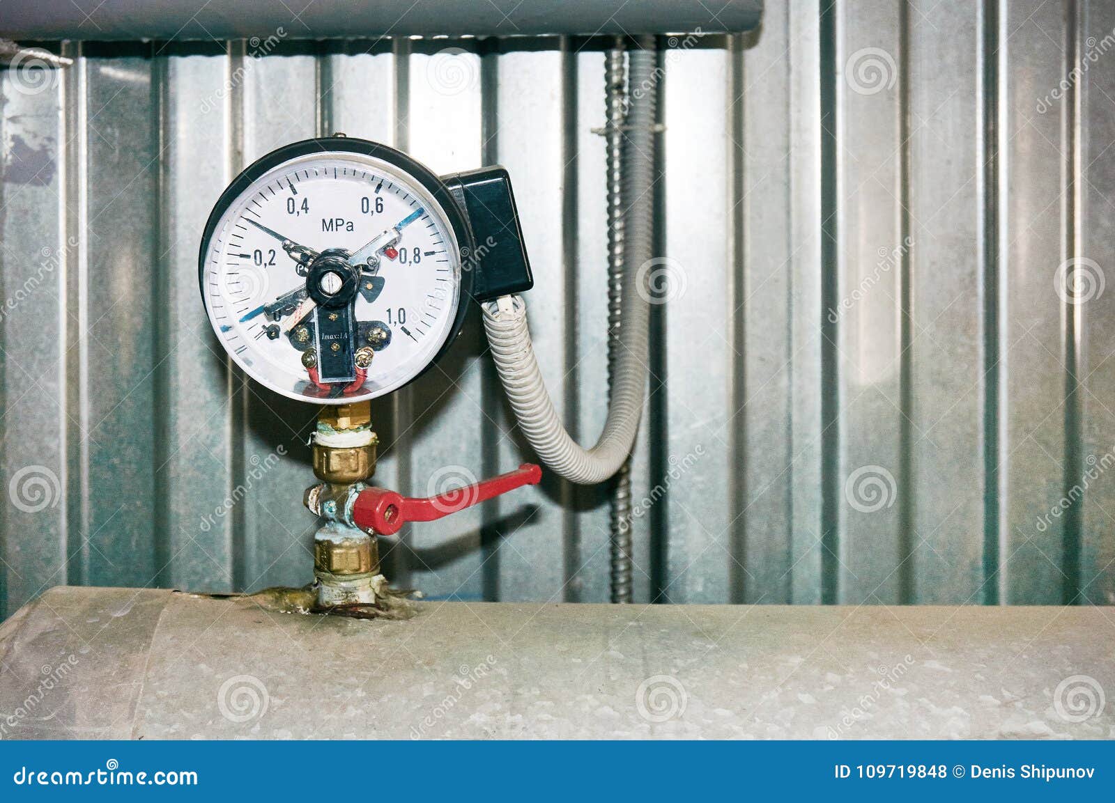 A Pressure Gauge with Electrical Contacts and a Connected Wire ...
