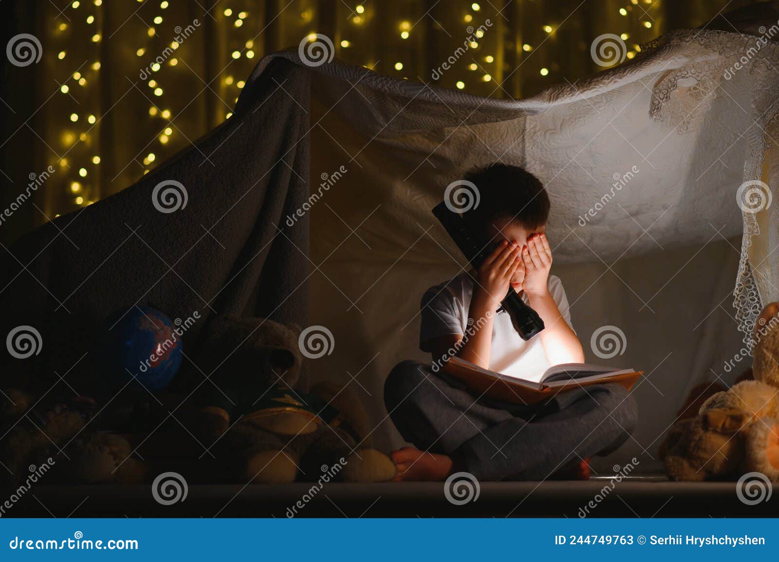 Preteen Boy with Flashlight Reading Book at Home. Stock Image - Image ...