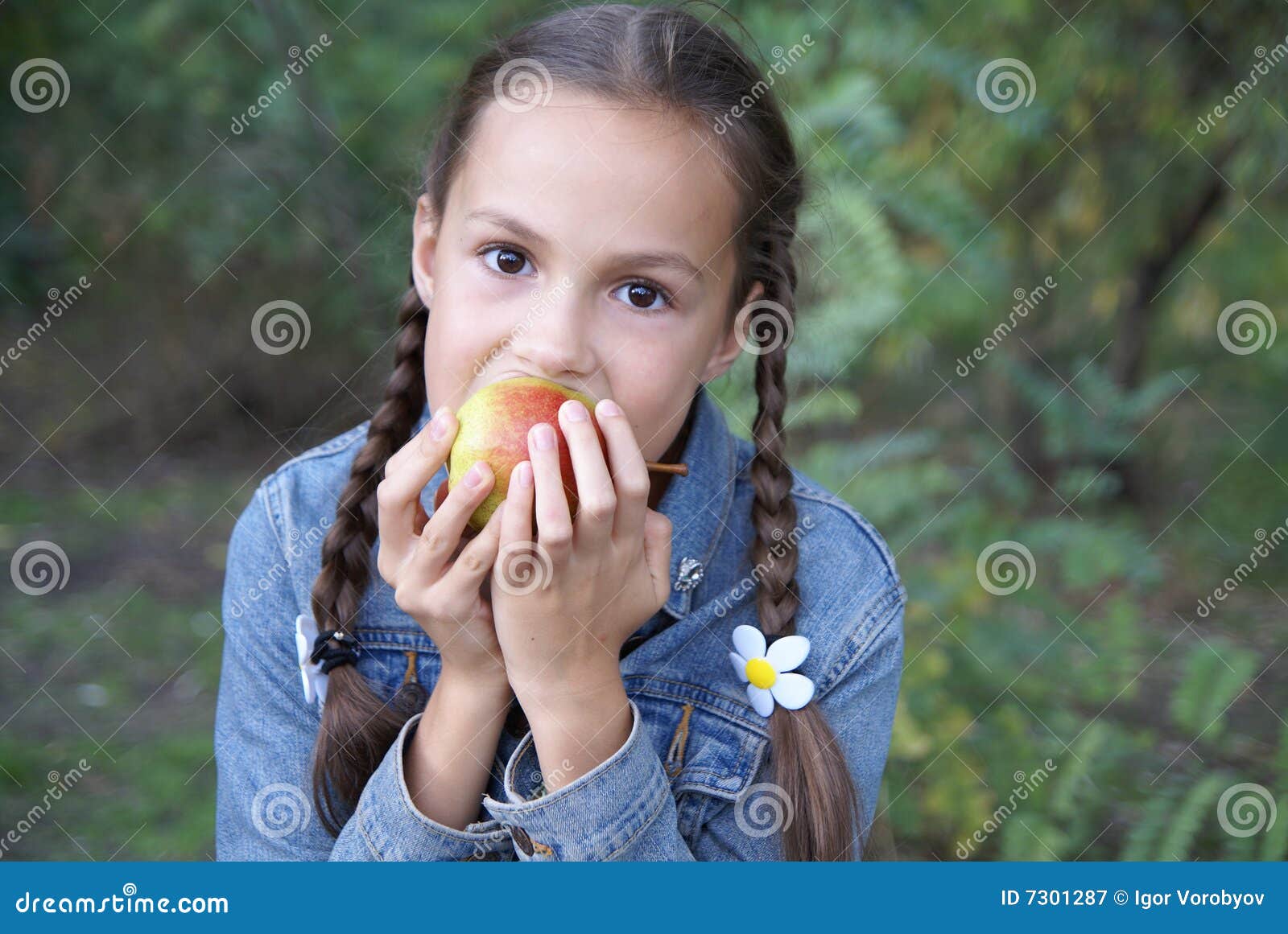 Preteen girl biting a pear stock image. Image of fruit - 7301287