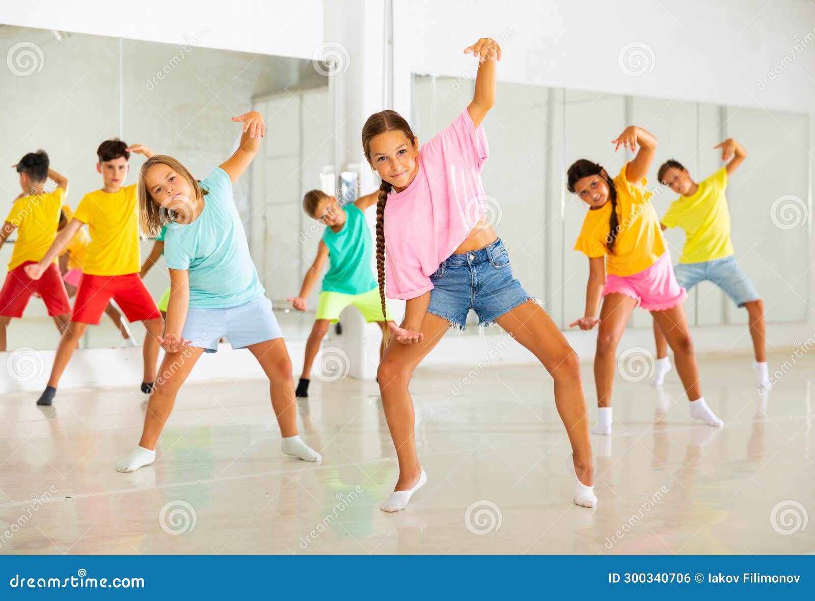 Preteen Girl Practicing Hip-hop Movements during Group Dance Lesson ... Preteen Girl Practicing Hip-hop Movements during Group Dance Lesson ...