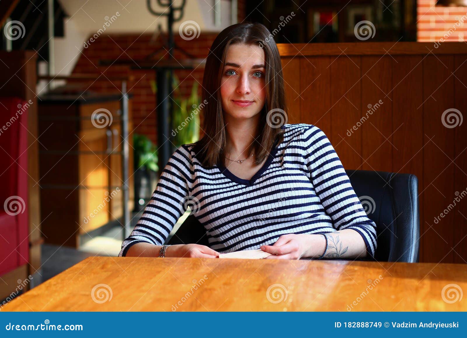 Pretty Alone Girl is Sitting at the Table in the Restaurant Stock Image ...
