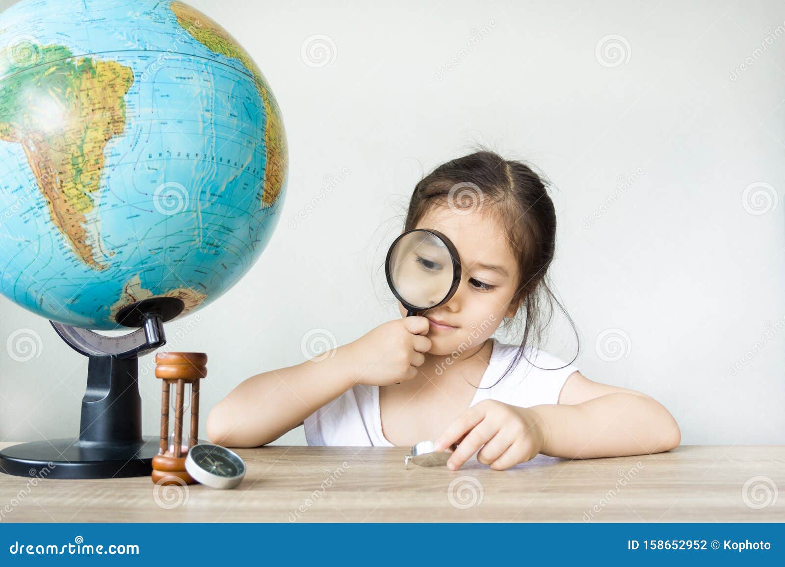 A Pretty Asian Girl Using Magnifying Glass Stock Photo - Image of back ...