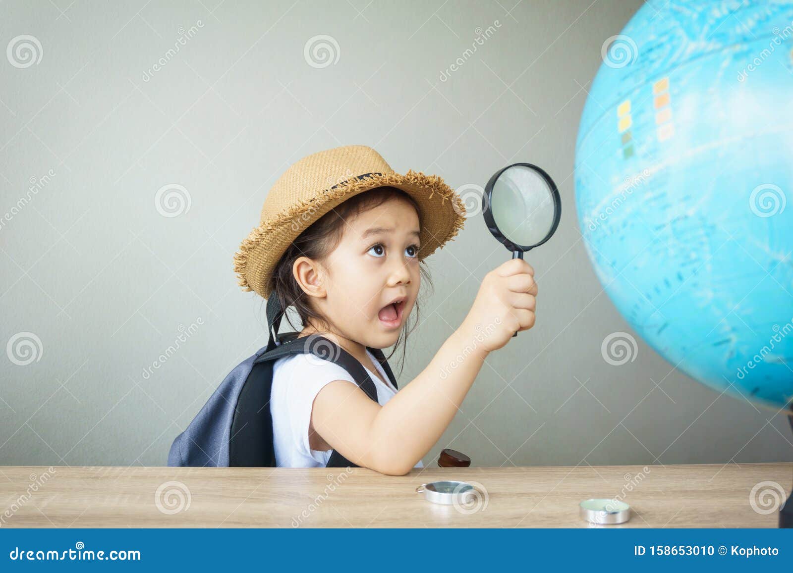 A Pretty Asian Girl Using Magnifying Glass Stock Photo - Image of rake ...