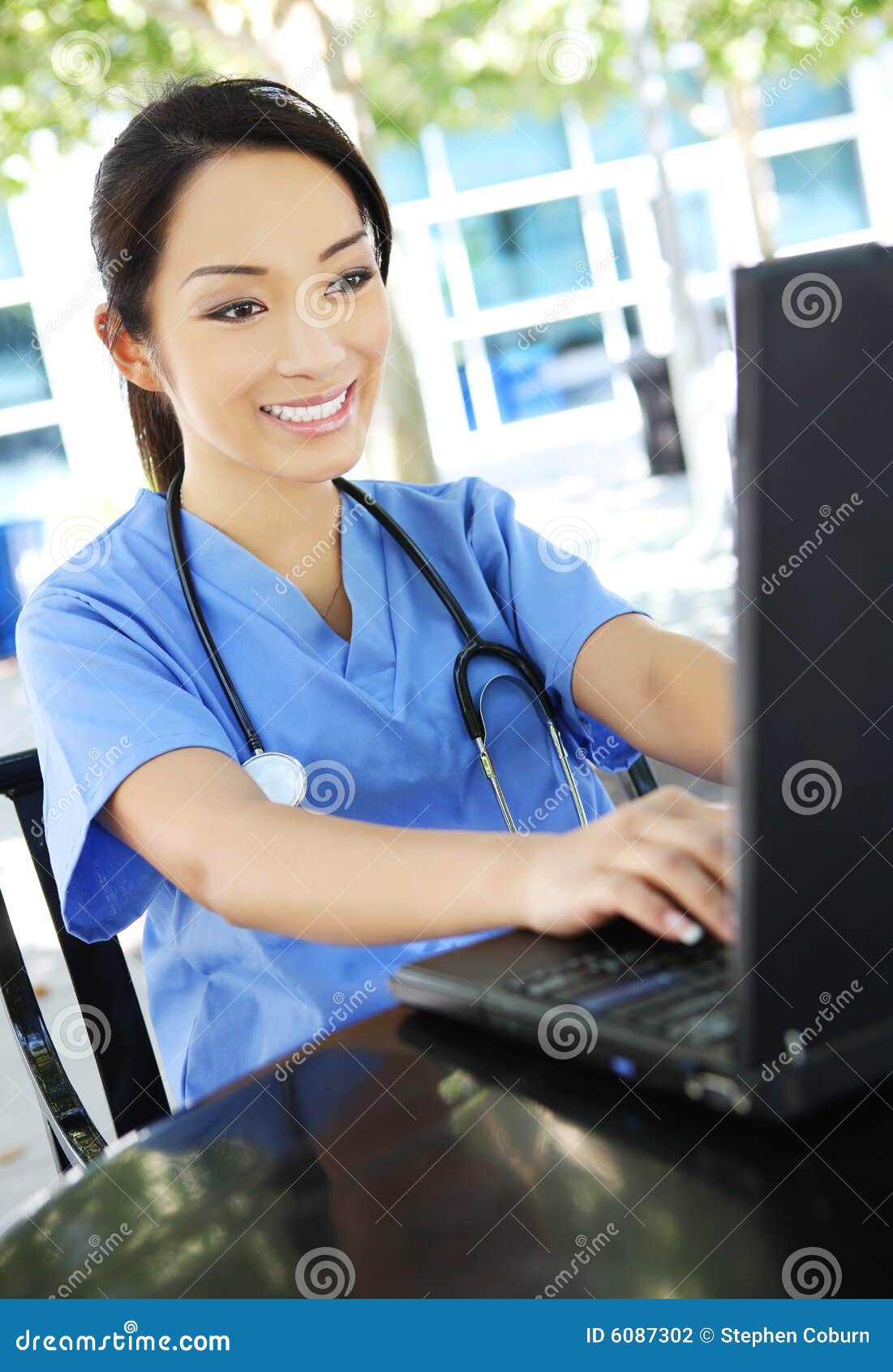 Pretty Asian Nurse Outside Hospital Stock Photo - Image of laptop ...