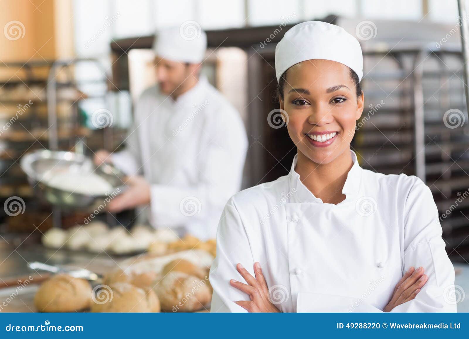 Pretty Baker Smiling at Camera Stock Photo - Image of chefs, industrial ...