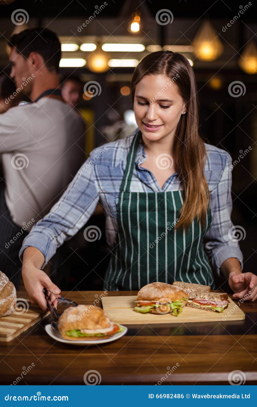 Pretty Barista Putting Sandwich in a Dish Stock Photo - Image of cafe ...