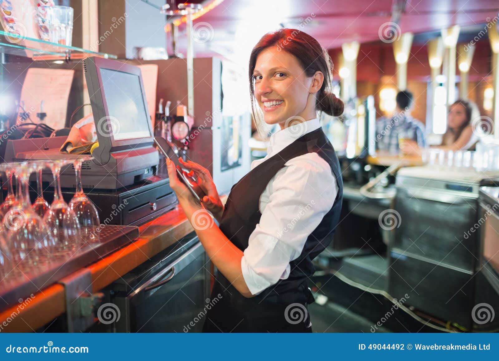 Pretty Barmaid Using Touchscreen Till Stock Photo - Image of food ...