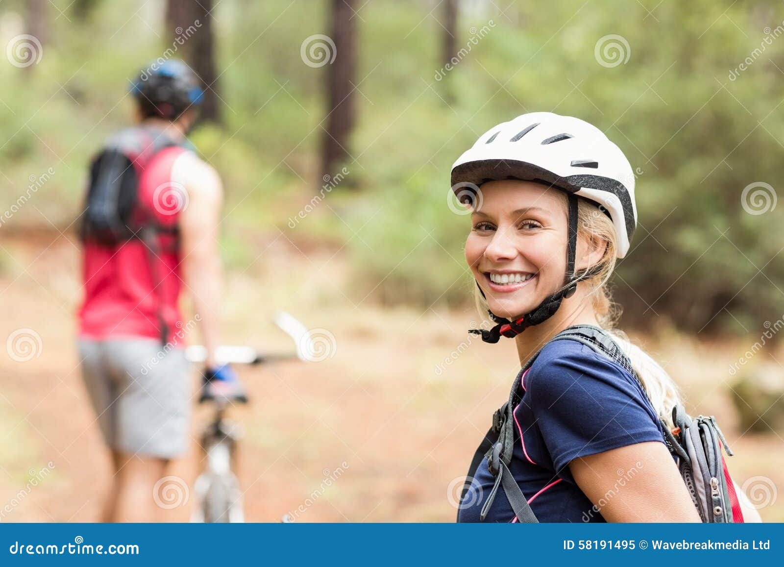 Pretty Biker Looking at Camera Stock Image - Image of female, cheerful ...