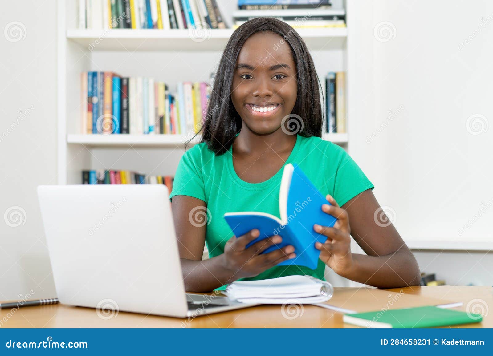 Pretty Black Female Student Learning with Books and Computer Stock ...