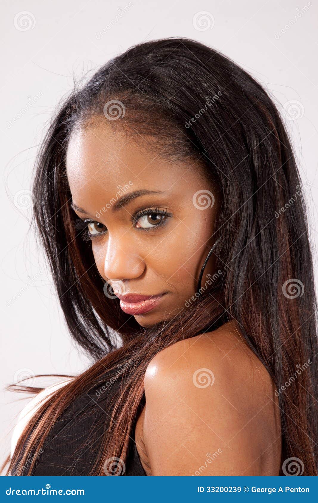 Pretty Black Woman Smiling Over Her Shoulder Stock Image - Image of ...