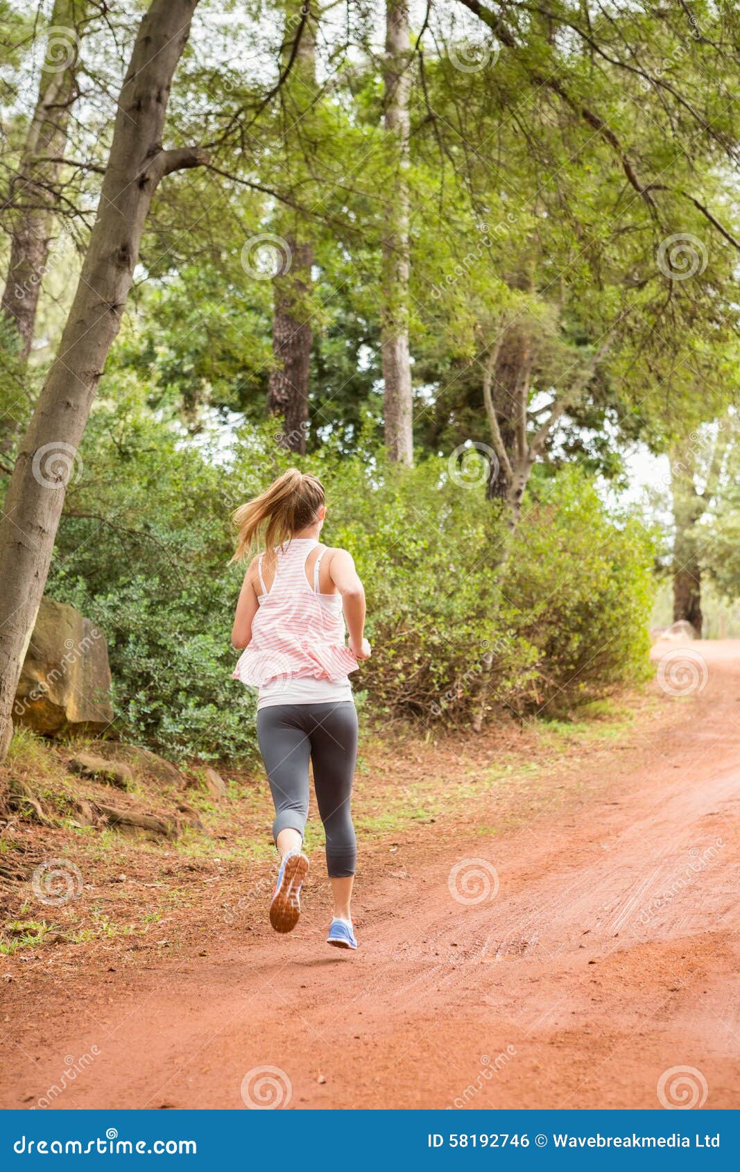 Pretty Blonde Athlete Jogging Stock Photo - Image of care, body: 58192746