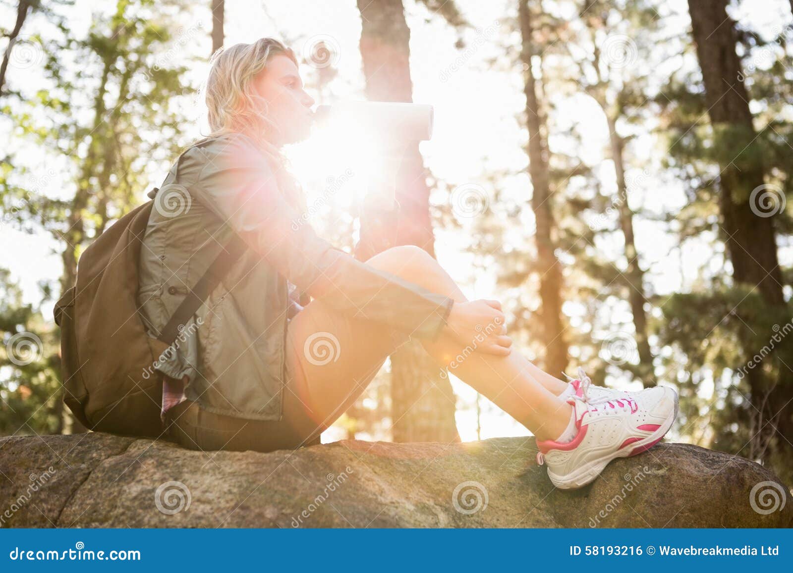 Pretty Blonde Hiker Drinking and Sitting on Stone Stock Photo - Image ...