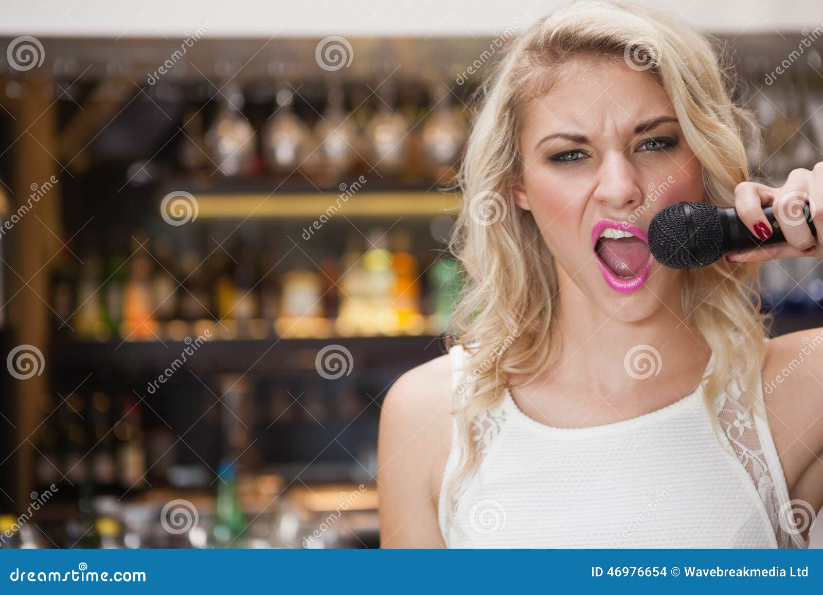 Pretty Blonde Singing with Her Microphone Stock Photo - Image of event ...