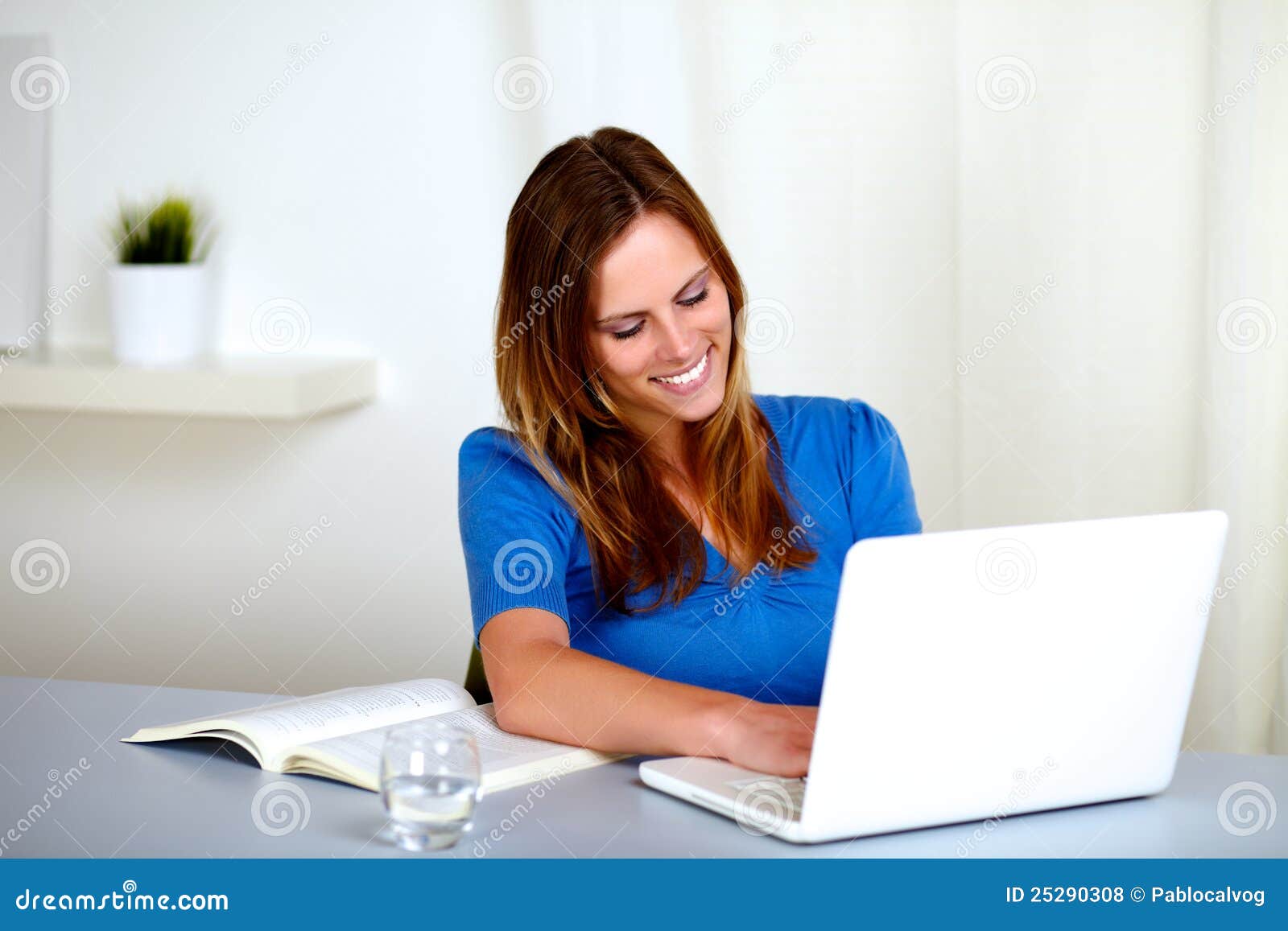 Pretty Blonde Young Girl Smiling and Studying Stock Photo - Image of ...