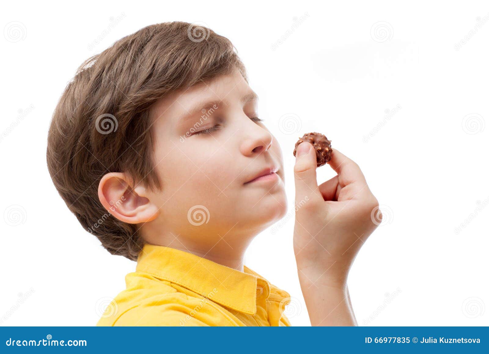 A Pretty Boy is Smelling Chocolate Ball Stock Image - Image of ...
