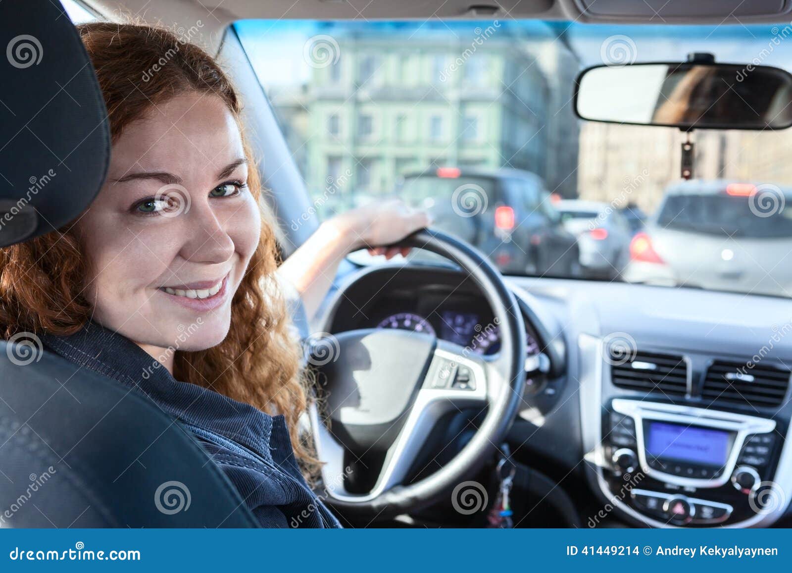 Pretty Brunette Driving Car, Looking Back at Camera Stock Photo - Image ...