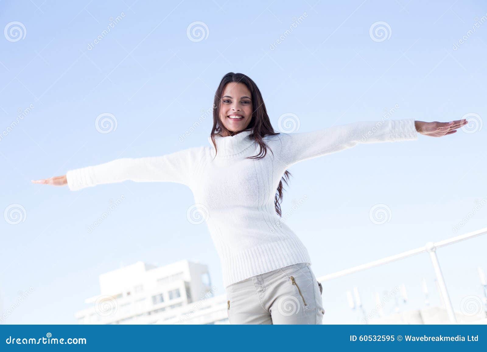 Pretty Brunette Feeling the Air with Arms Raised Up Stock Image - Image ...