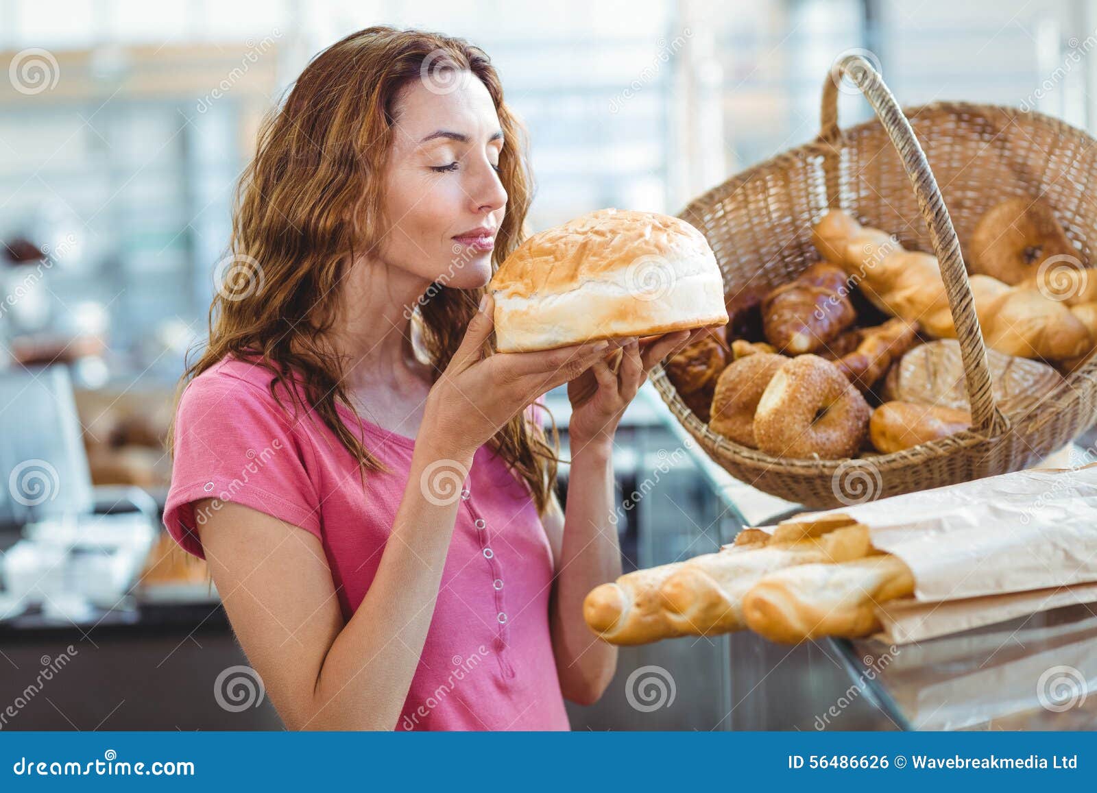 Pretty Brunette Smelling Loaf of Bread Stock Photo - Image of cheerful ...