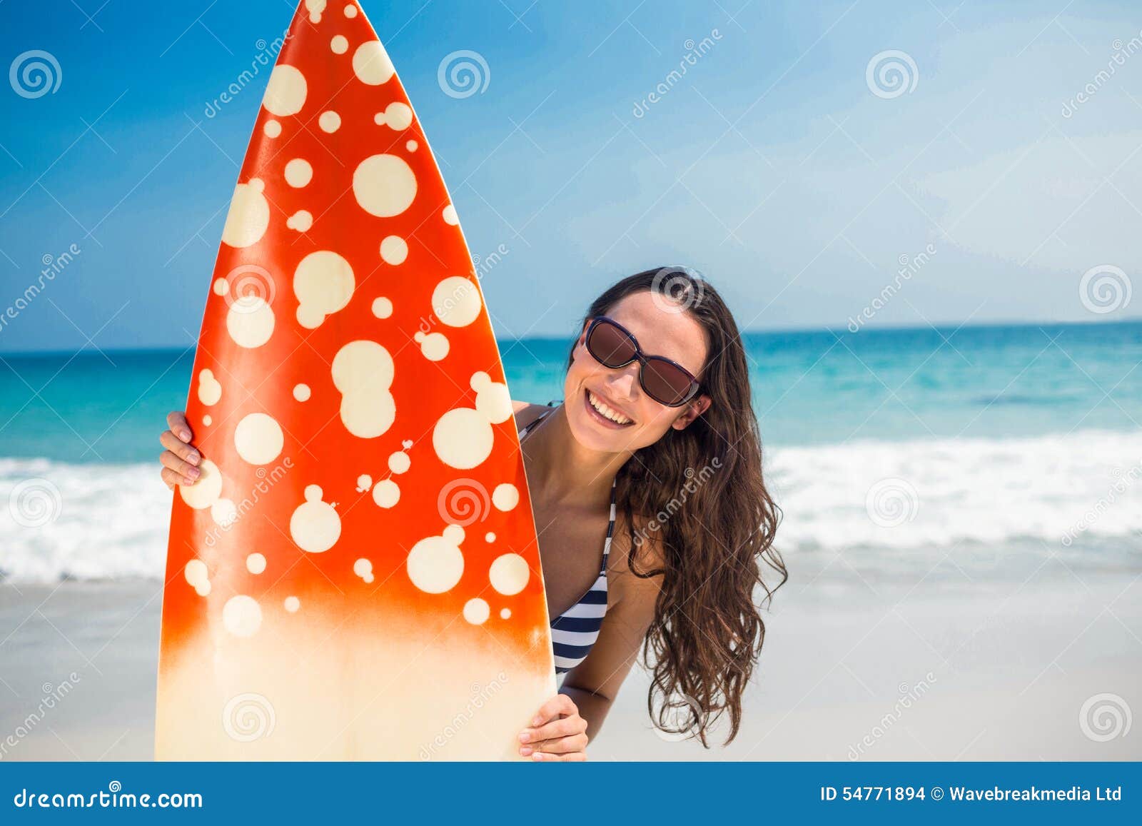 Pretty Brunette with a Surfboard Looking at Camera Stock Photo - Image ...