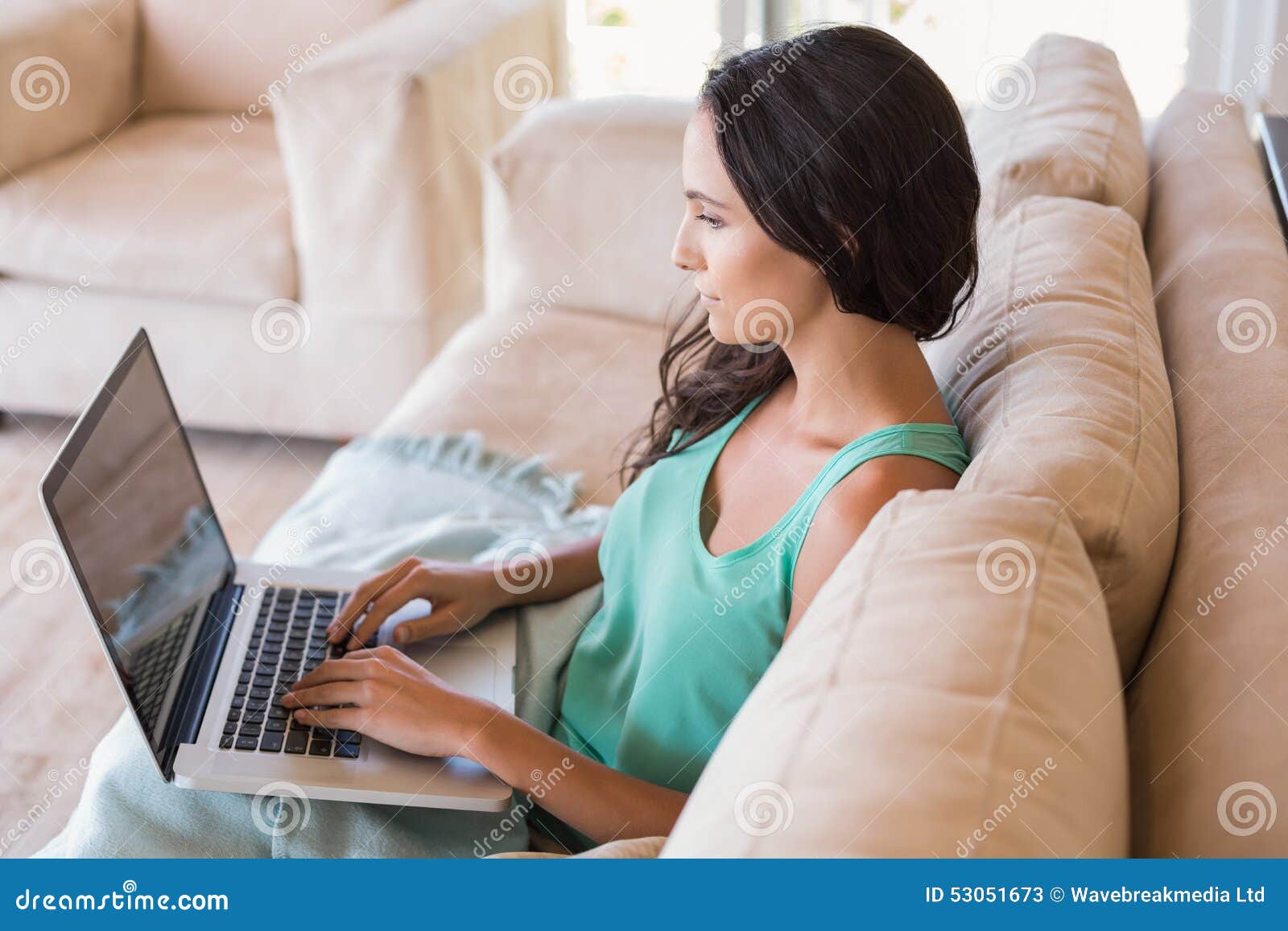 Pretty Brunette Using Her Laptop on the Couch Stock Image - Image of ...