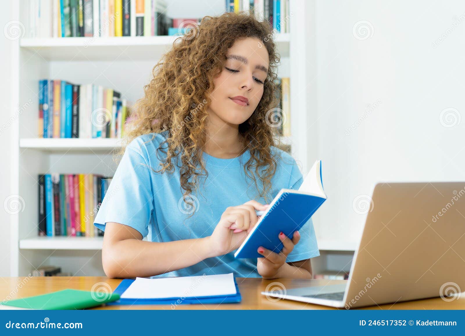 Pretty Caucasian Female Student Reading Reference Book Stock Photo ...