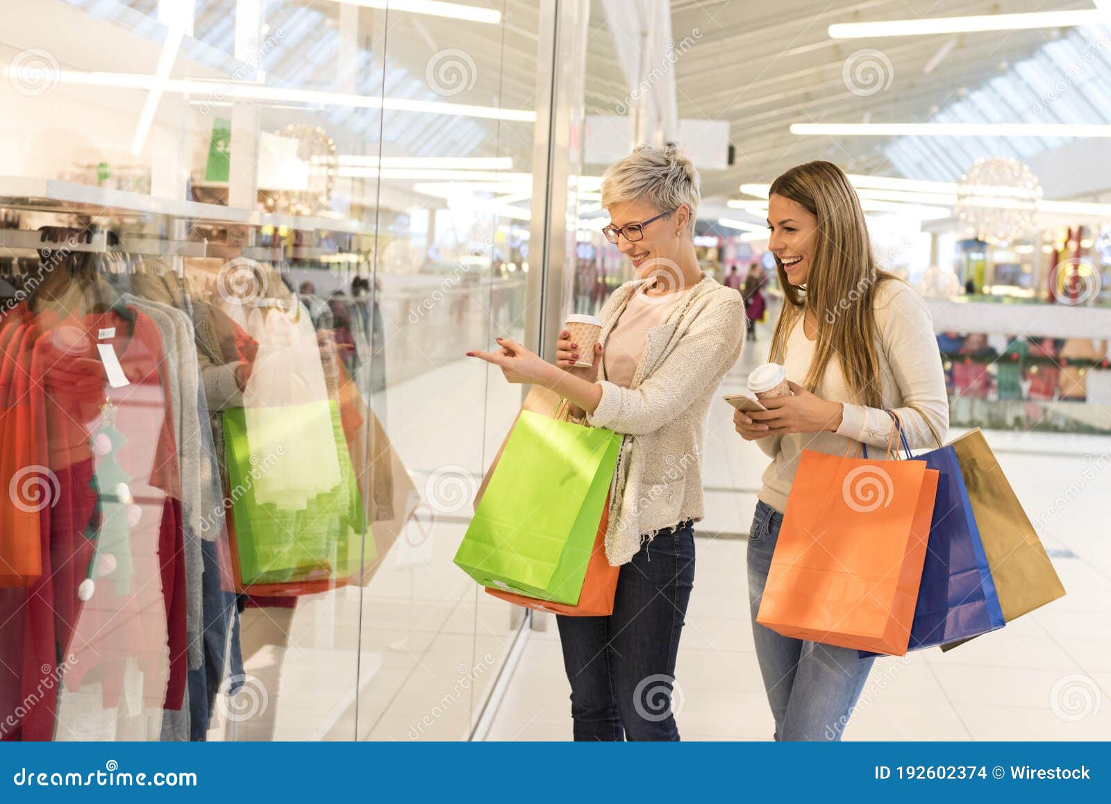 Pretty Caucasian Friends Doing Shopping in a Shopping Centre Stock ...