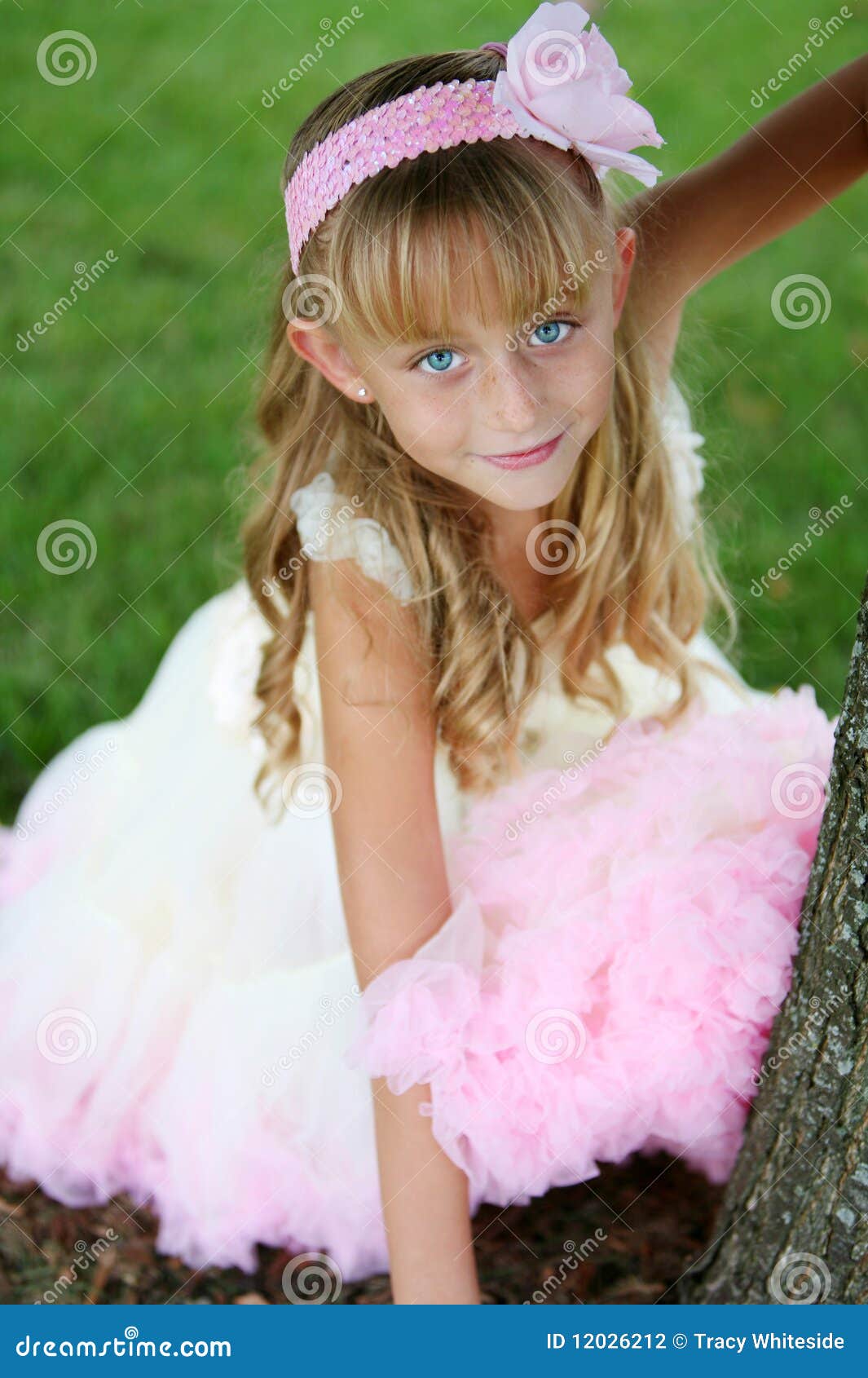 Pretty child crouching stock photo. Image of average - 12026212