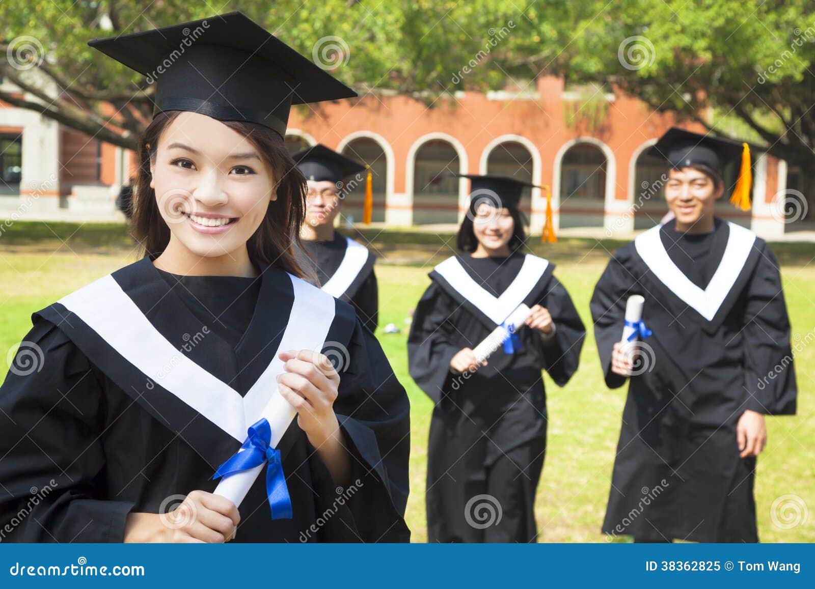 Pretty College Graduate Holds a Diploma with Classmates Stock Image ...