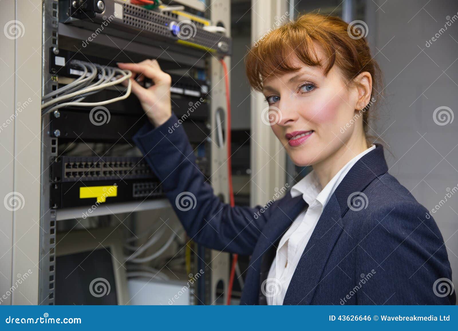 Pretty Computer Technician Smiling at Camera while Fixing Server Stock ...