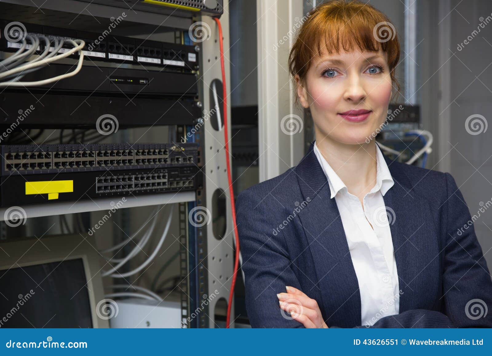 Pretty Computer Technician Smiling at Camera beside Server Stock Image ...