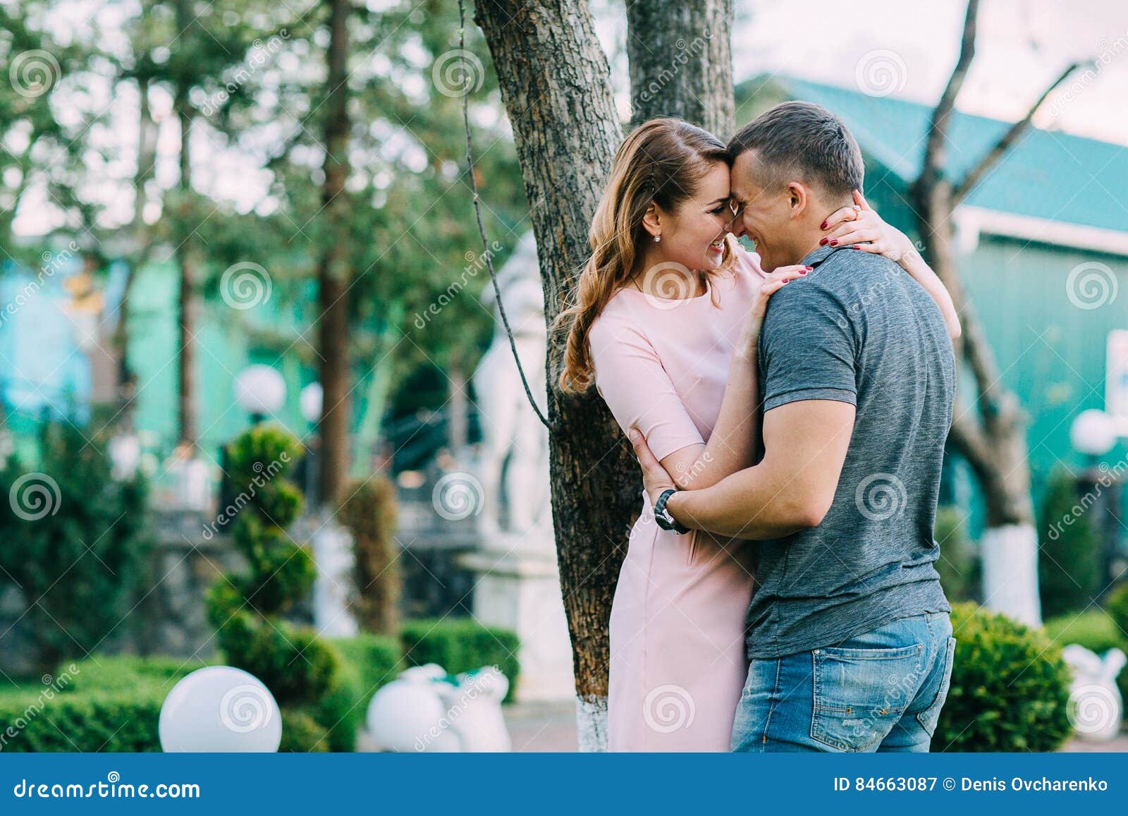 Pretty Couple Hugging and Flirting in an Urban Park Stock Image - Image ...