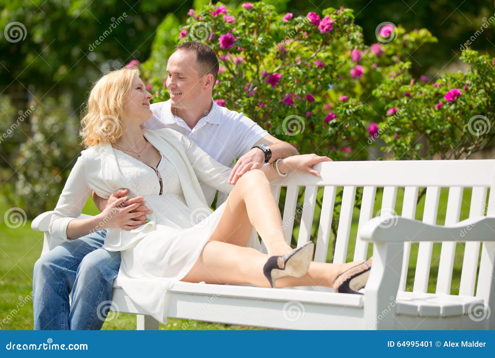 Pretty Couple Sits and Embrace on a Bench in Park Outdoors Stock Image ...