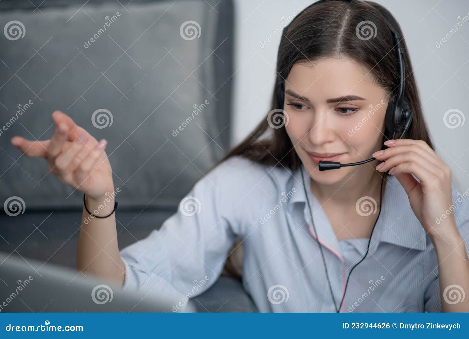 A Pretty Dark Haired Operator Of Call Canter Working From Home Stock