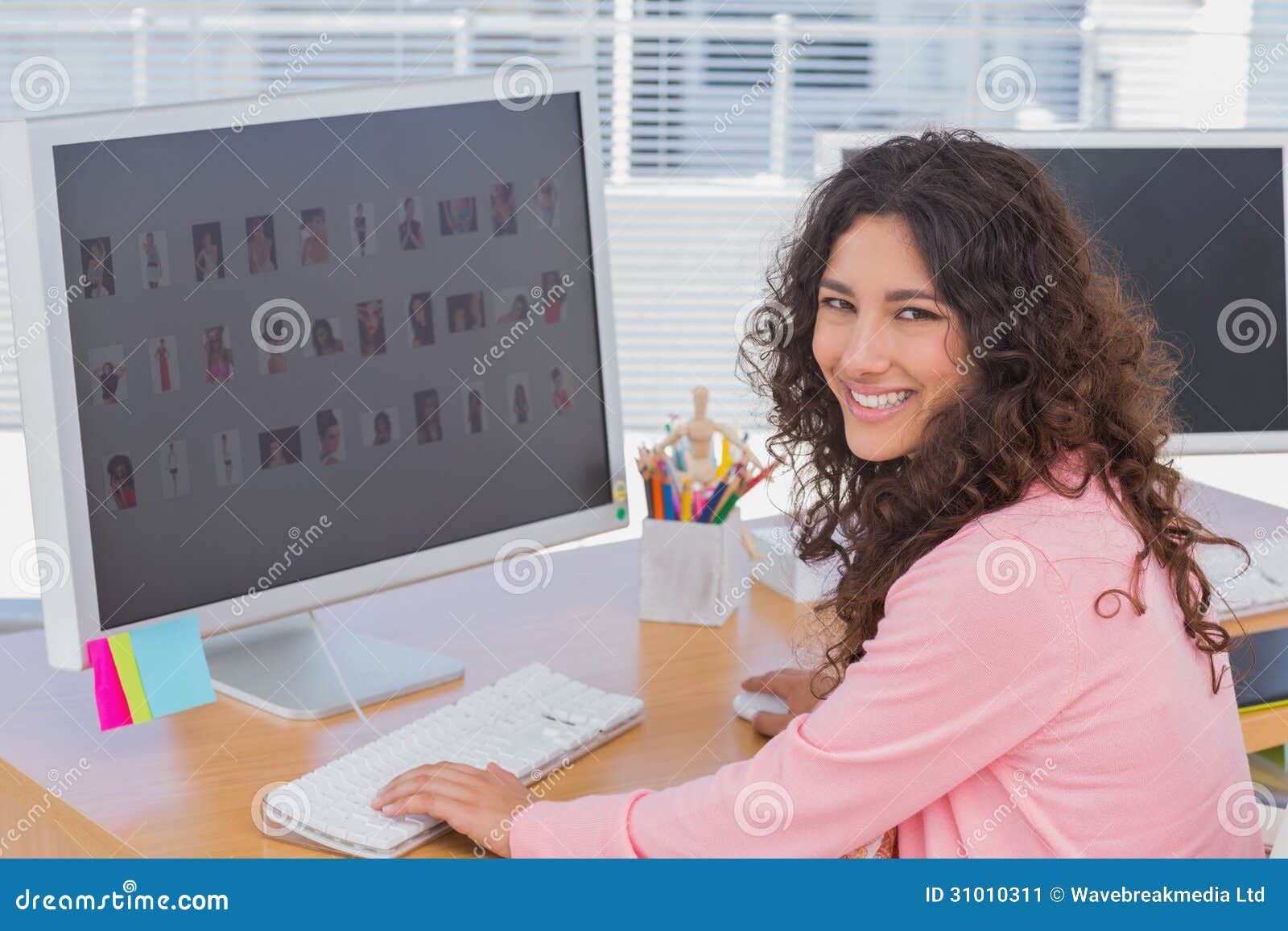 Pretty editor at her desk stock image. Image of cool - 31010311