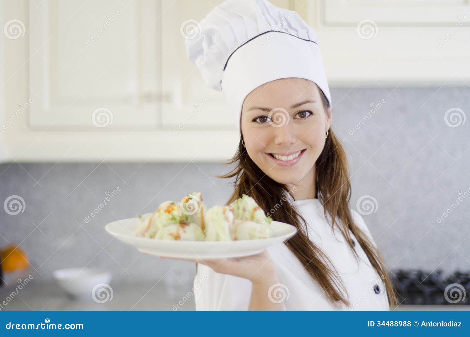 Pretty Female Chef with a Dish Stock Photo - Image of girl, apron: 34488988