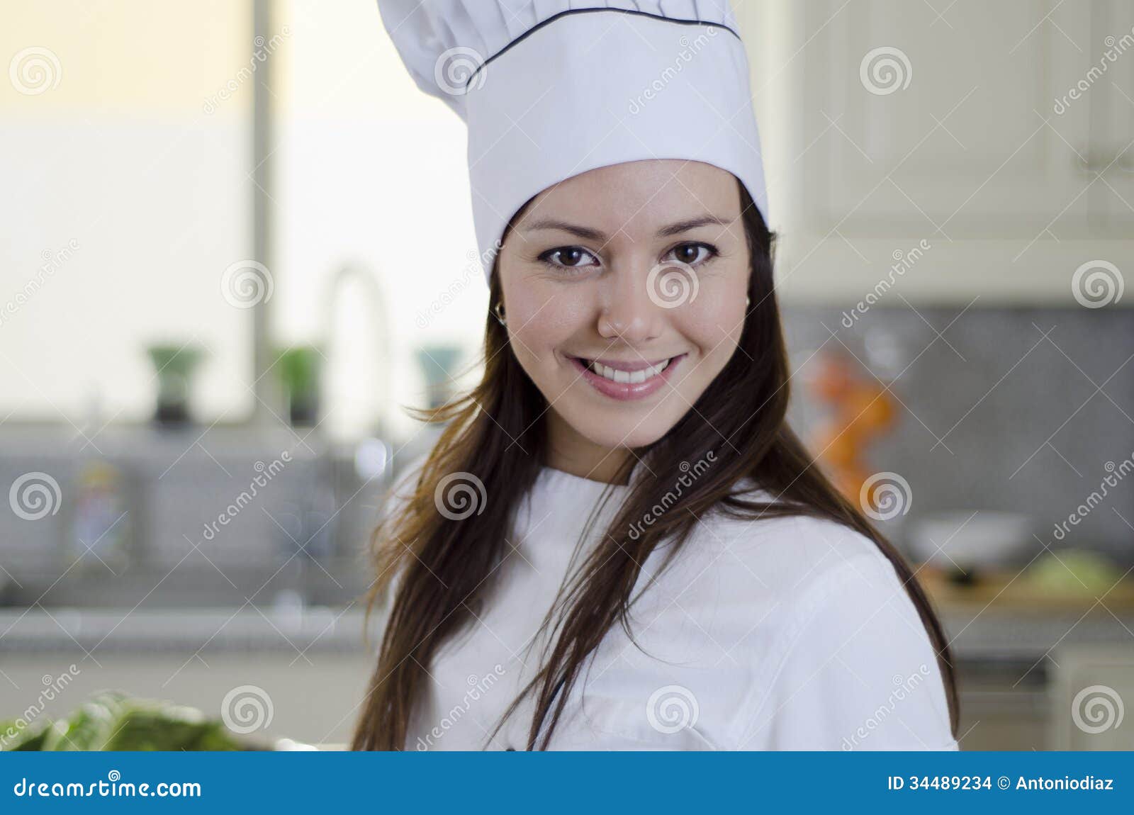 Pretty Female Chef in a Kitchen Stock Photo - Image of chef, cook: 34489234