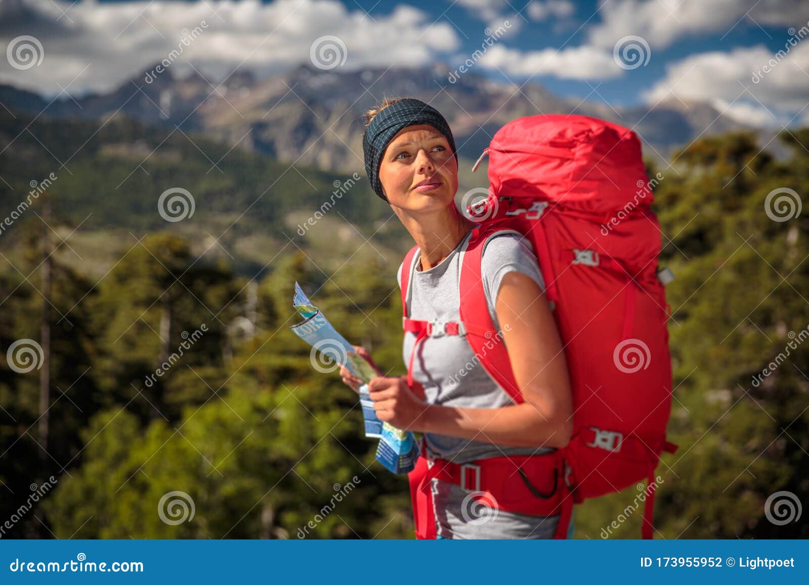 Pretty, Female Hiker in High Mountains Using a Map Stock Photo - Image ...