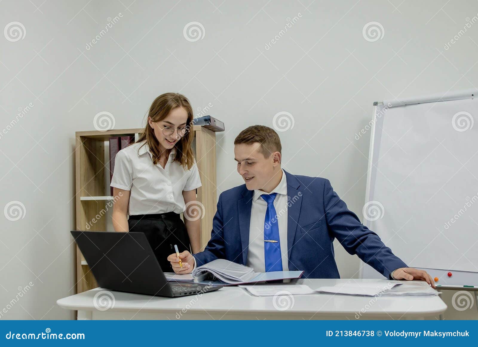 Pretty Female Showing Document To Her Boss in the Office Stock Photo ...