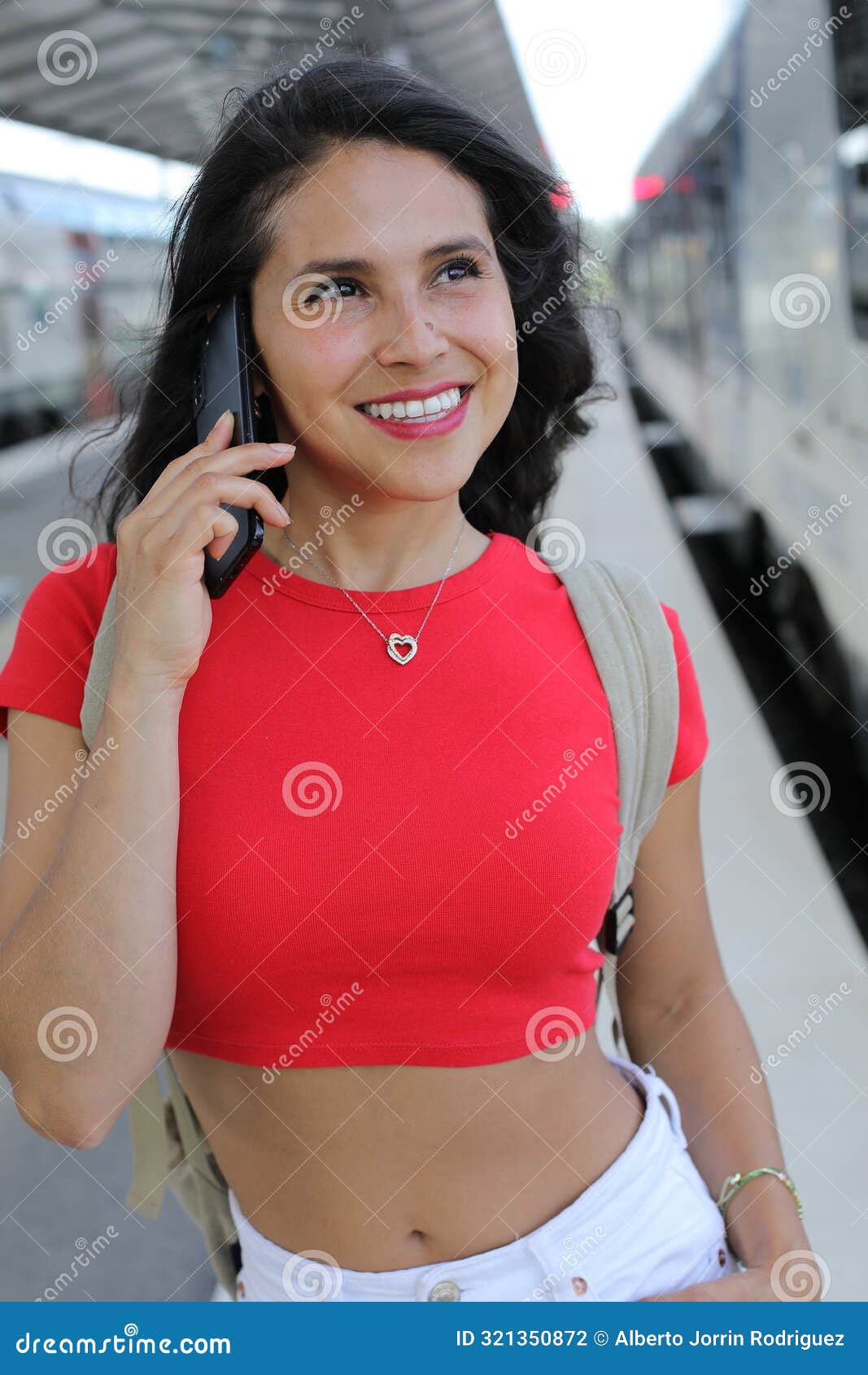 Pretty Female Student Making a Phone Call from a Train Station Stock ...