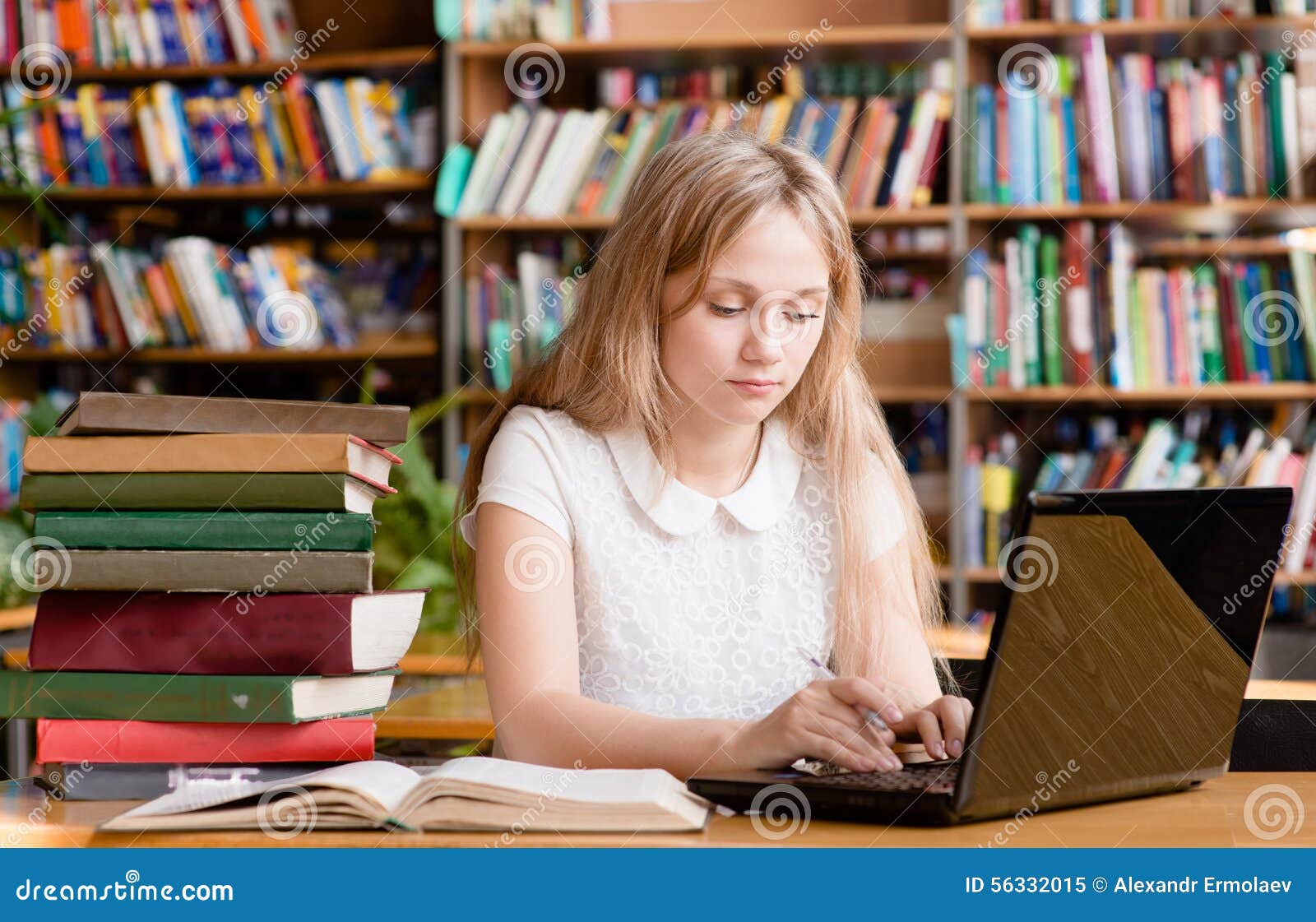 Pretty Female Student Typing on Notebook in Library Stock Image - Image ...