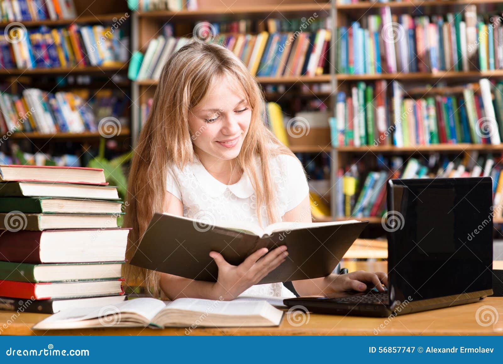 Pretty Female Student Typing on Notebook in Library Stock Image - Image ...