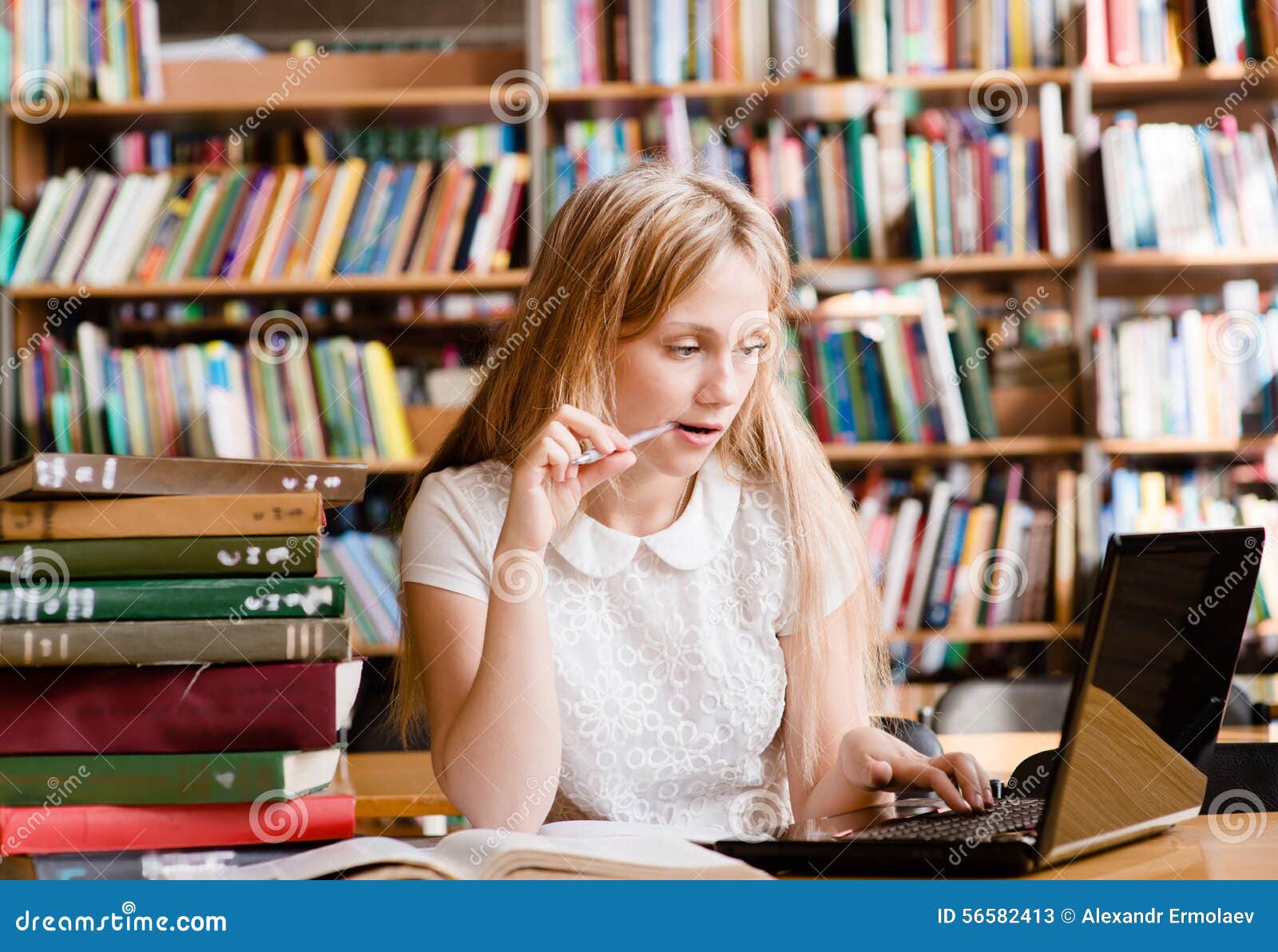 Pretty Female Student Using Laptop in Library Stock Image - Image of ...