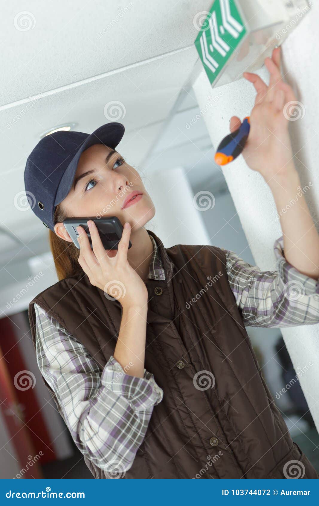 Pretty Female Technician on Phone Stock Photo - Image of caucasian ...