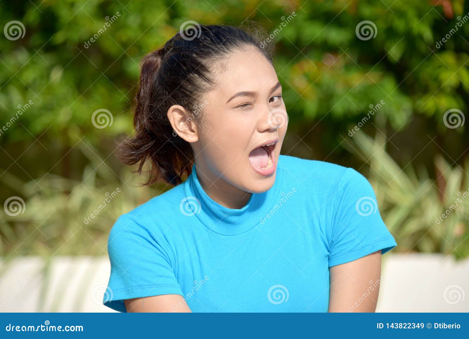 A Pretty Female Winking stock image. Image of lashes - 143822349