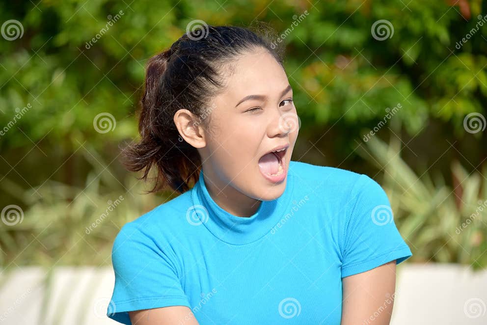 A Pretty Female Winking stock image. Image of lashes - 143822349